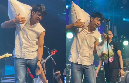 Thái Lan: Idol đang hát bị fan kéo ra nhận donate bao gạo